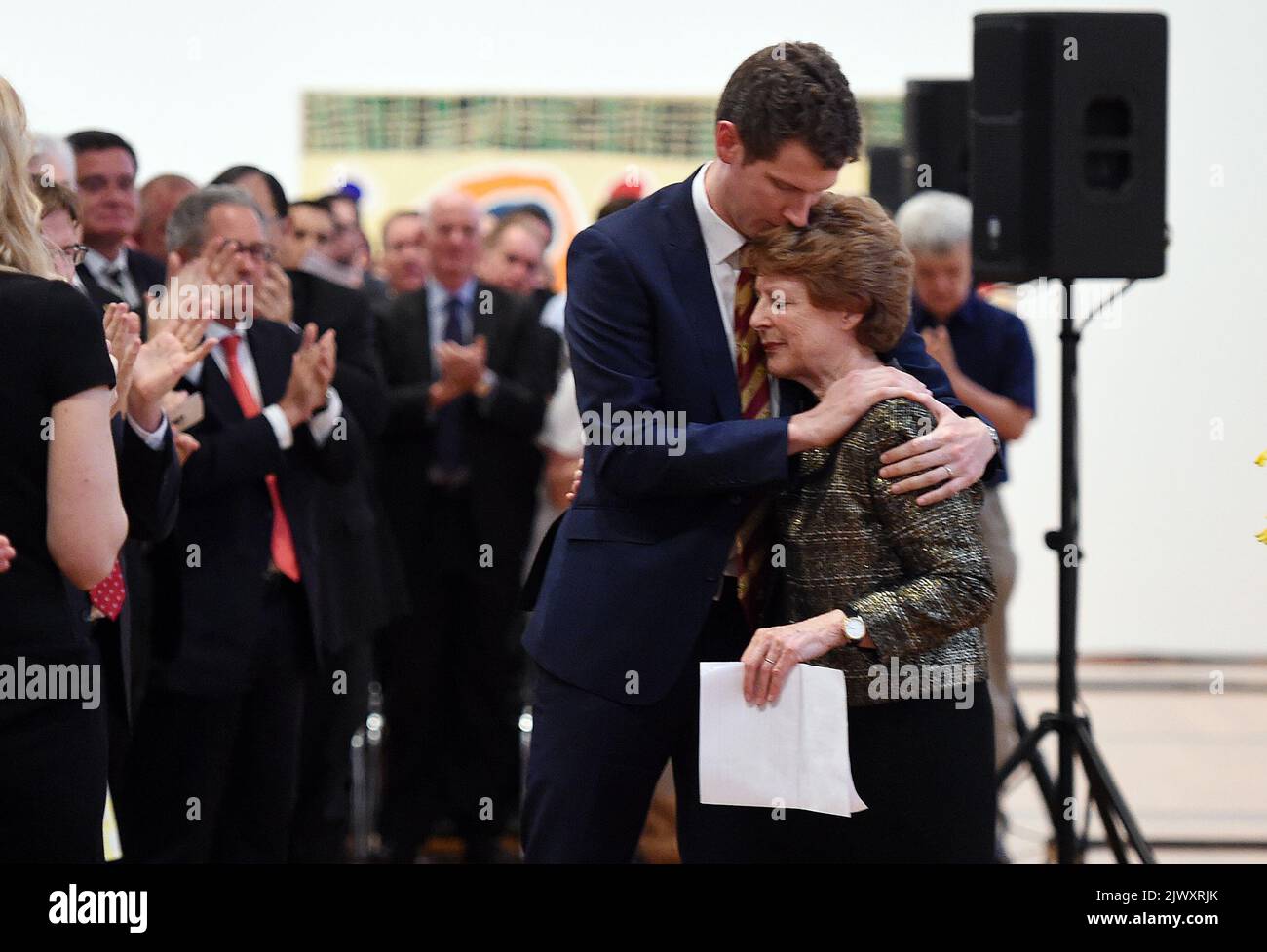 Former Queensland premier Wayne Goss wife Roisin is hugged by their son ...
