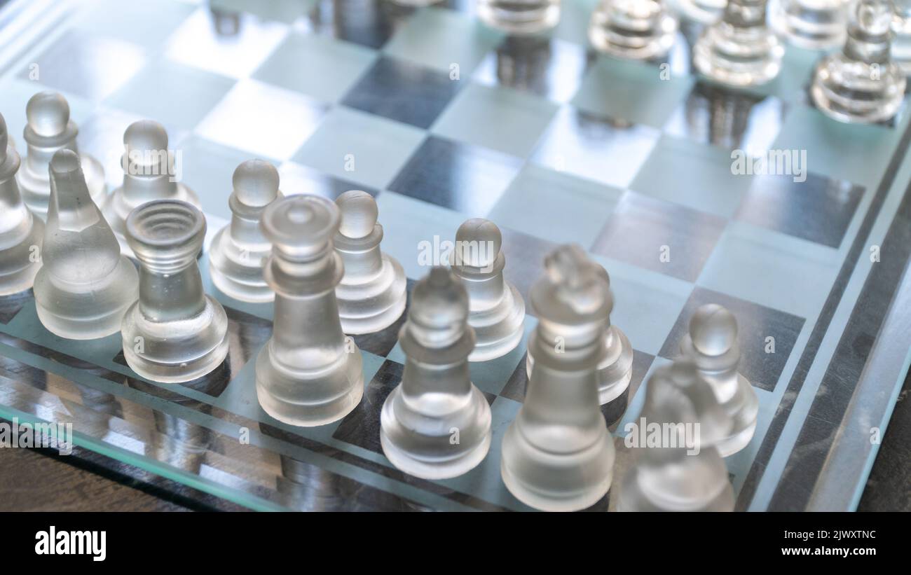 Chess game. Chess pieces made of glass. Rivalry concept. Selective ...