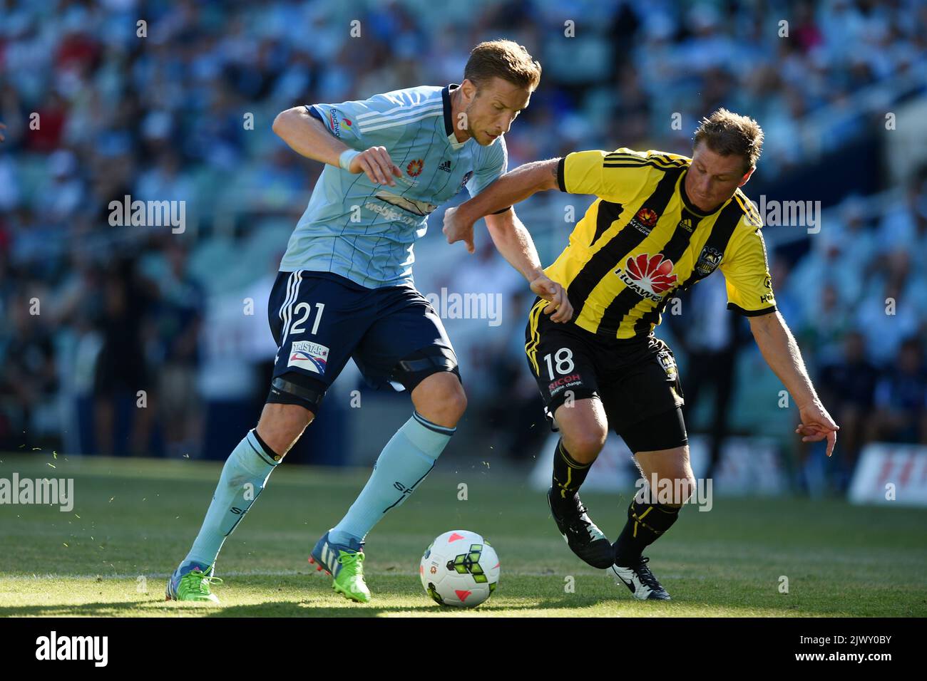 Mark Janko of Sydney competes for possession with Ben Sigmund , (right ...
