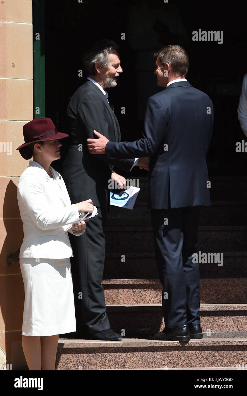 NSW Premier Mike Baird, (right), greets the step-father of Tori Johnson ...