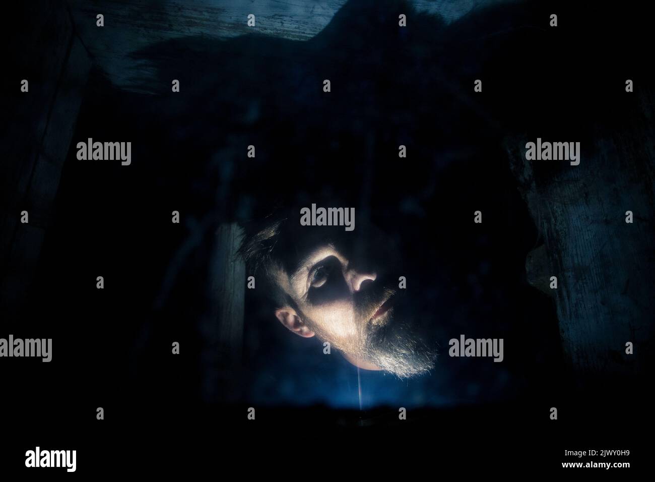 scary man behind window with spider nets at night Halloween horror ...