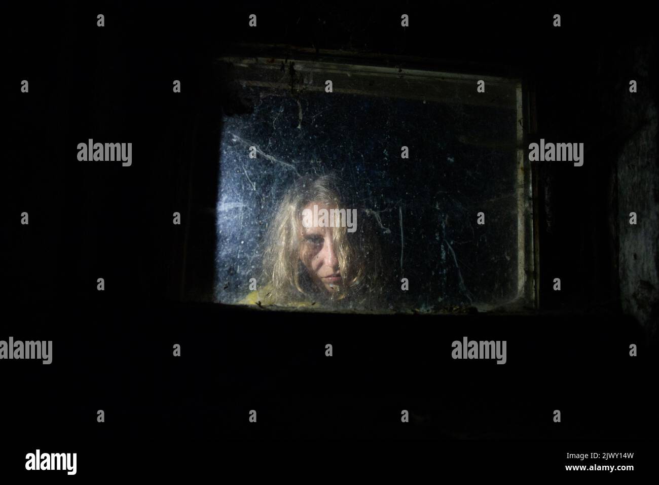 scary woman behind window at night Halloween horror background Stock ...