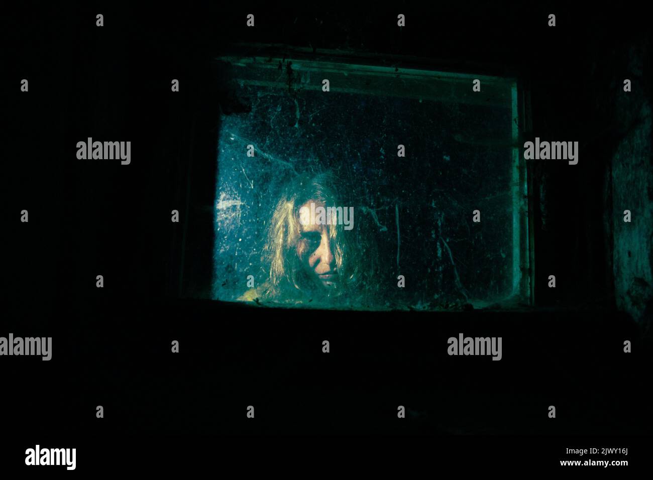 scary woman behind window at night Halloween horror background Stock ...