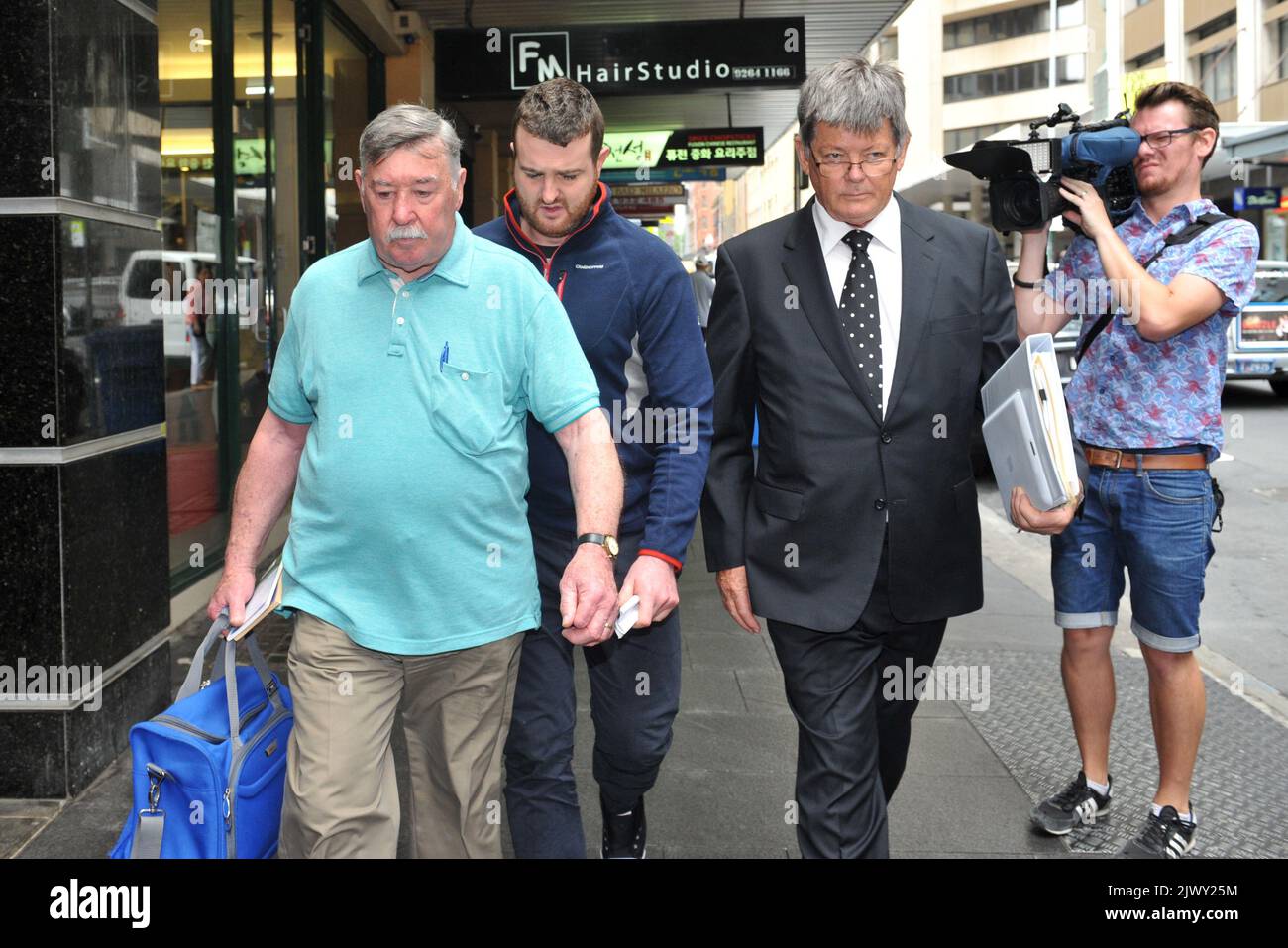 Barry Lyttle (centre) leaves with his father, Oliver Lyttle, after ...