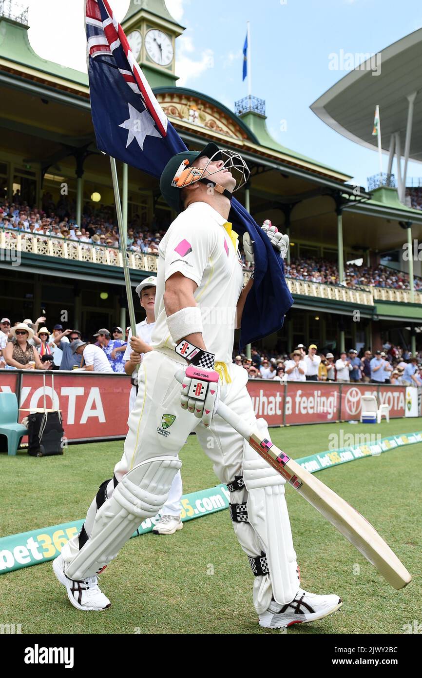 Australian batsman David Warner looks to the sky as he leads team mate ...