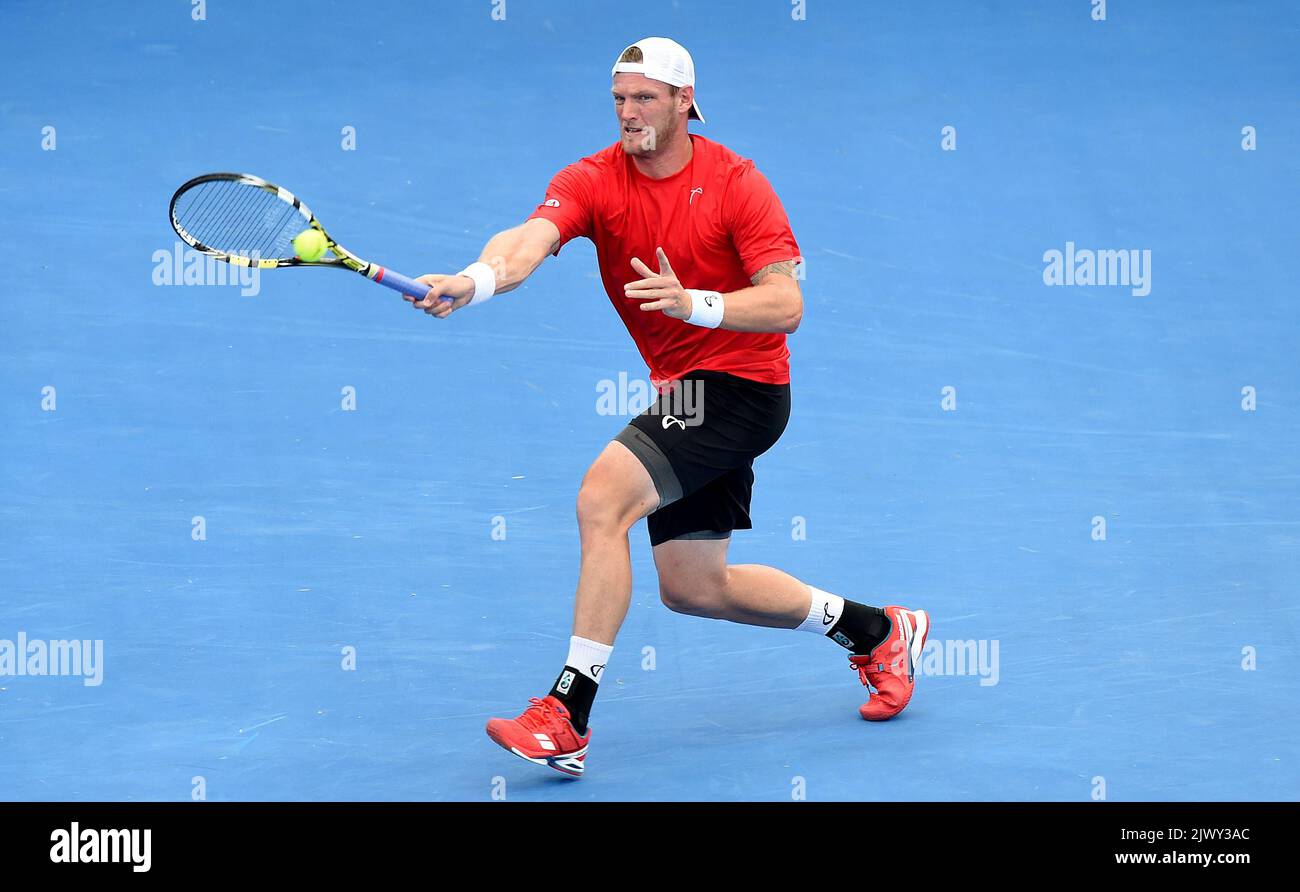 Australian Sam Groth returns during his match against Milos Raonic of ...