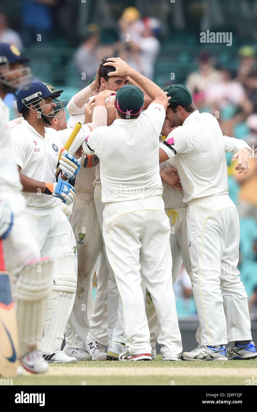 Australia's Mitchell Starc celebrates the LBW wicket of India's Suresh ...