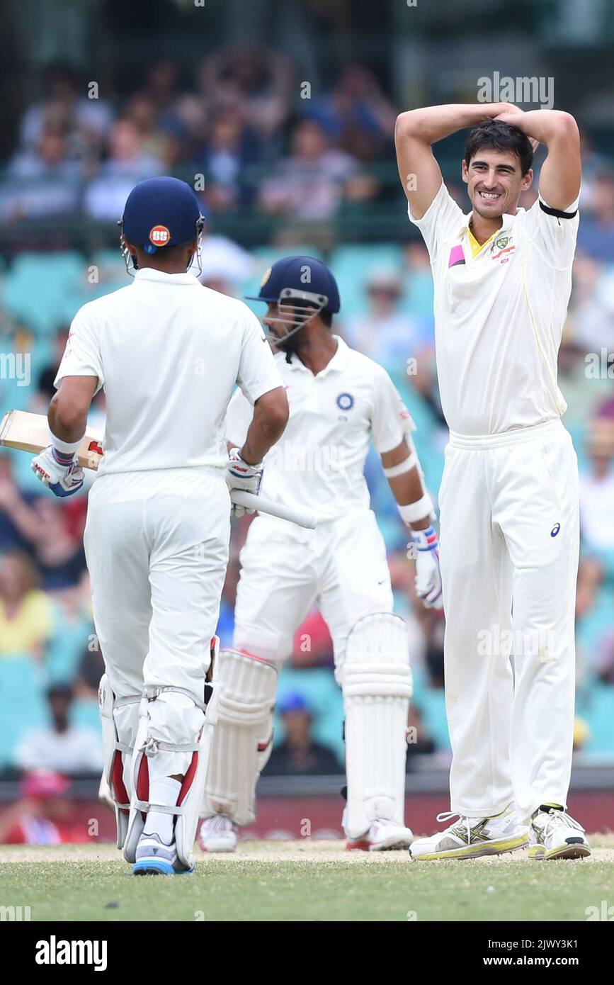 Australia's Mitchell Starc reatcs after being hit for four by India's ...