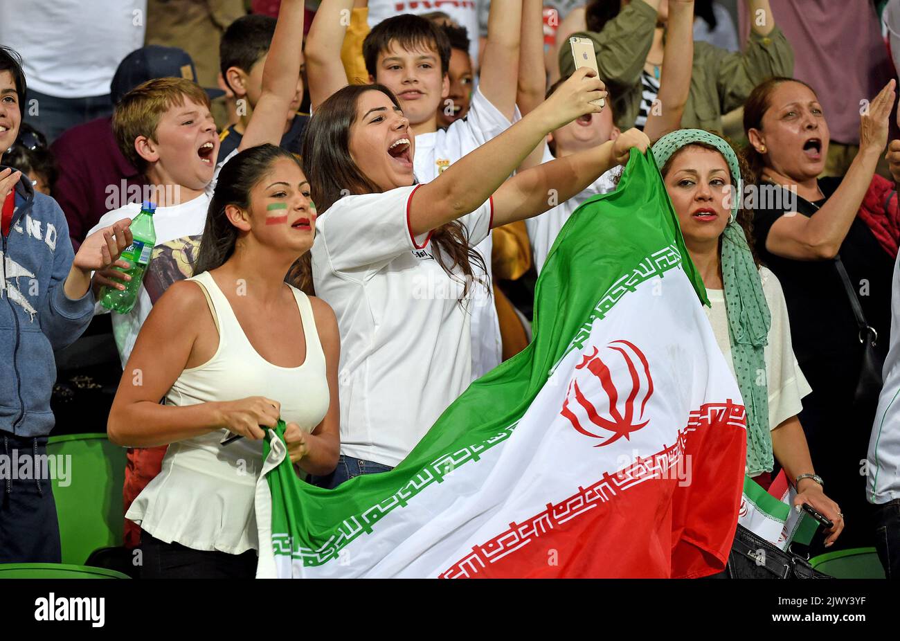 Iranian fans celebrate after a goal, during the Group C Asian Cup match ...
