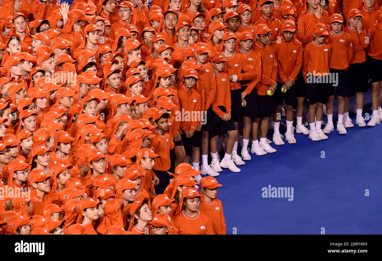 Ball boys pose for photos at the Rod Laver Arena in Melbourne, Tuesday ...
