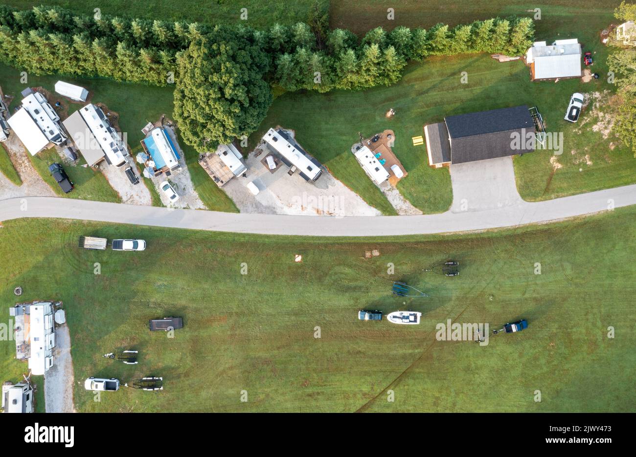 RV, motor home and caravan camping on a beautiful green campground park ...