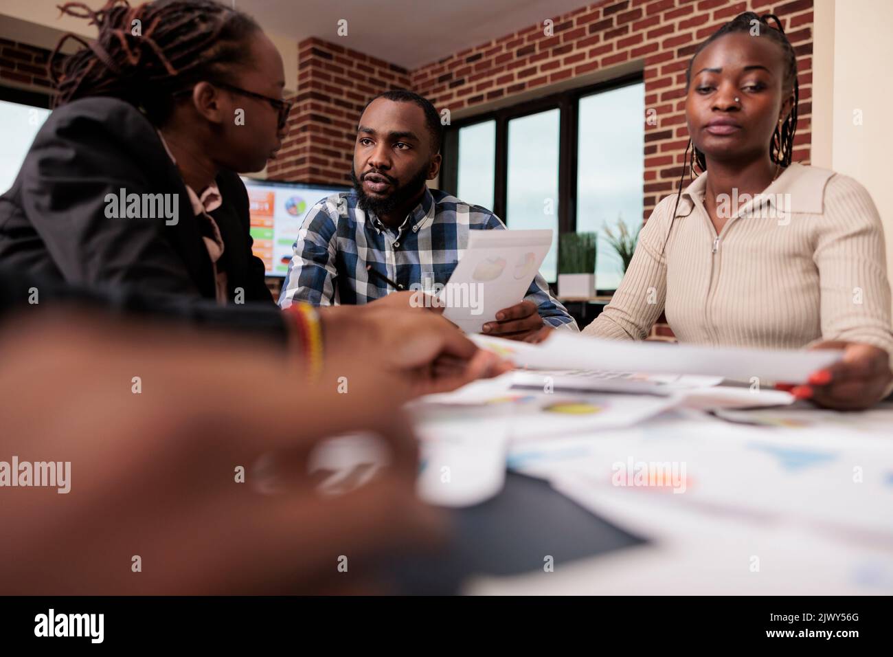 African american employees doing teamwork at job, working with startup ...