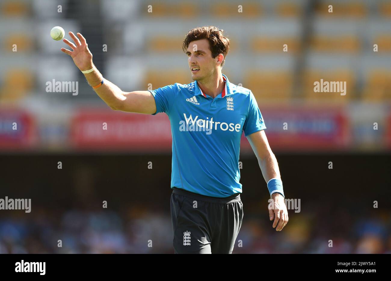 England bowler Steven Finn receives the ball during the Tri-Series One ...