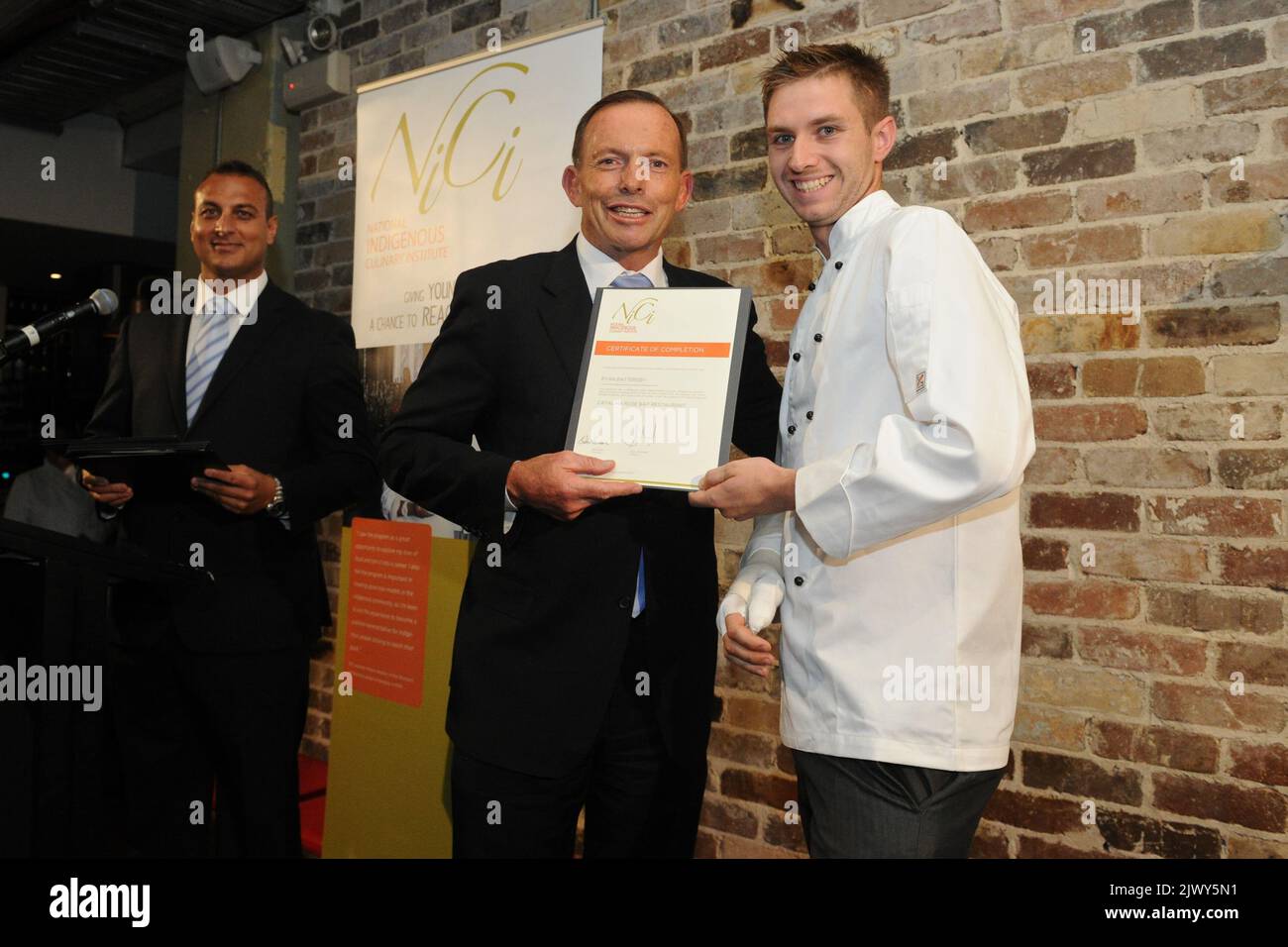 Prime Minister Tony Abbott presents an award to Ryan Battersby at Cafe ...
