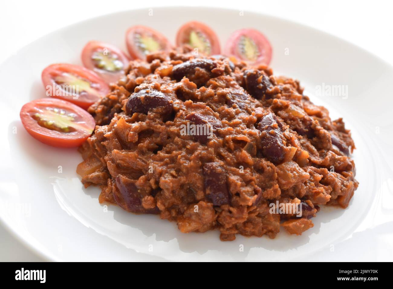 Chilli con carne on a white plate. Traditional Mexican food Stock Photo ...
