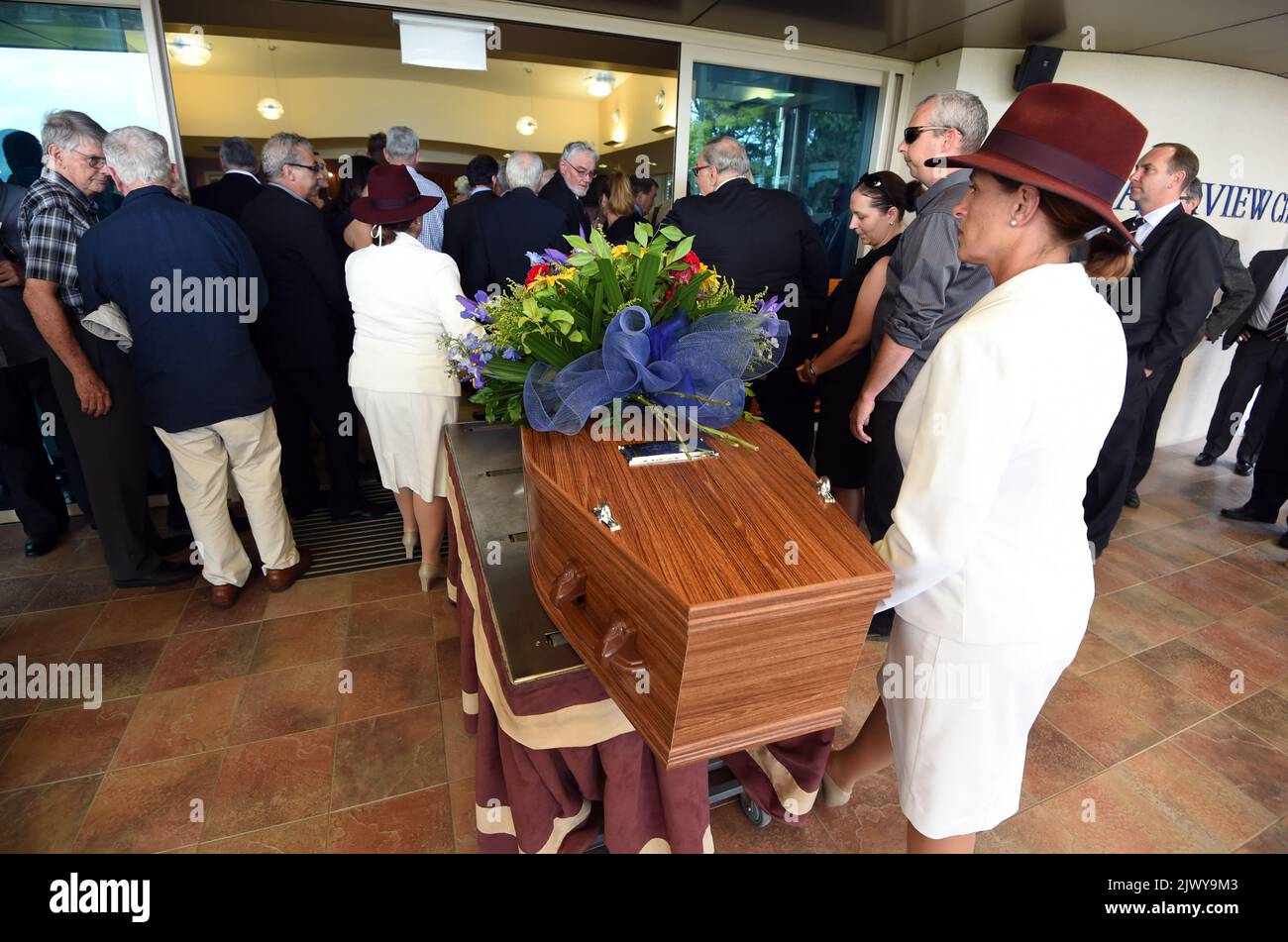 The coffin of veteran journalist Harry Gordon is brought into the ...