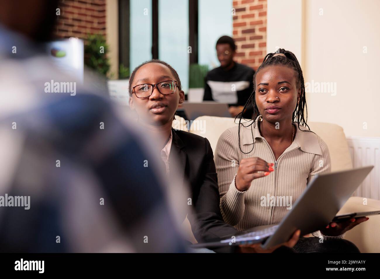 African american coworkers doing startup teamwork in startup office ...