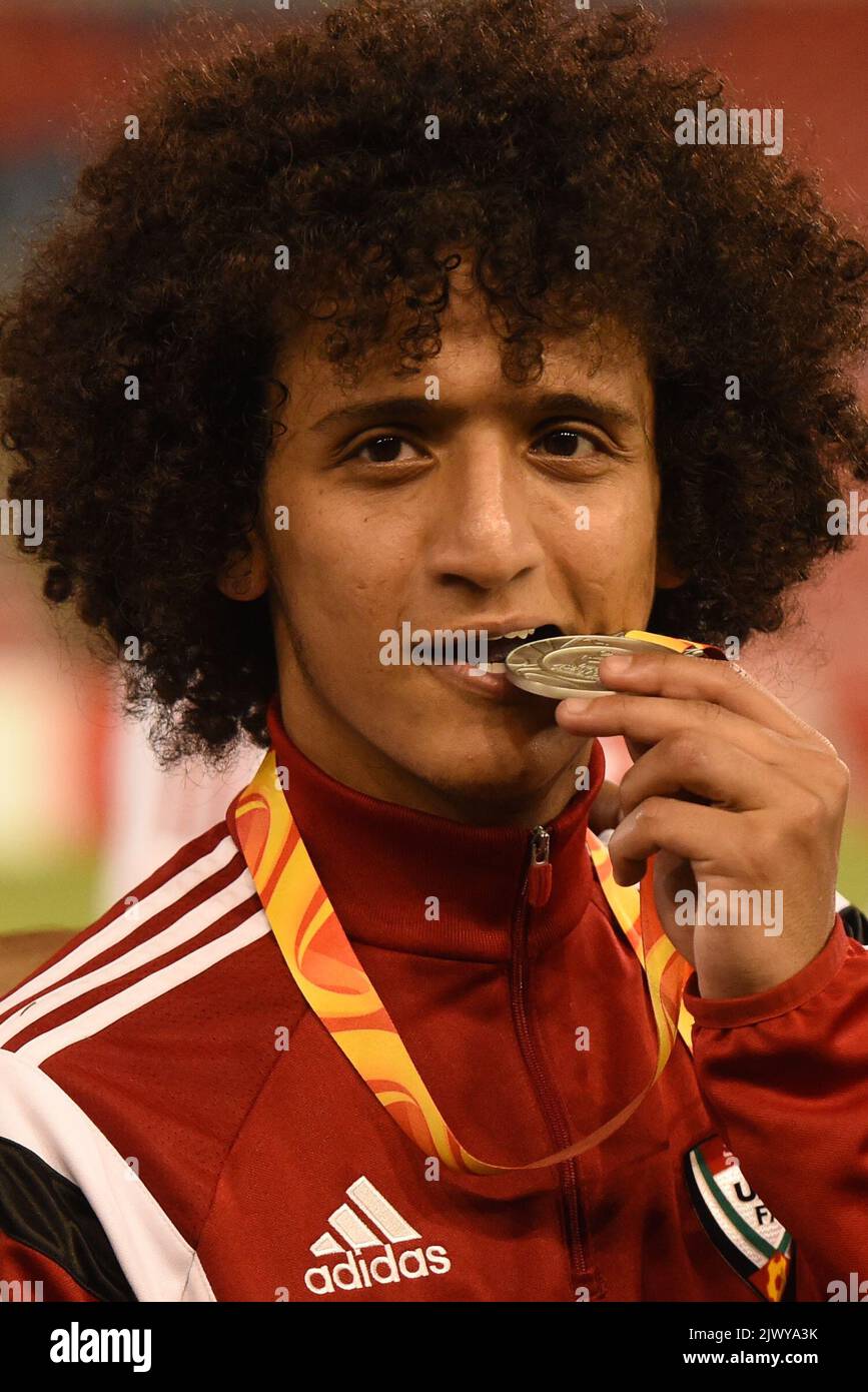 Omar Abdulrahman of UAE bites his 3rd place medal following their 3rd ...