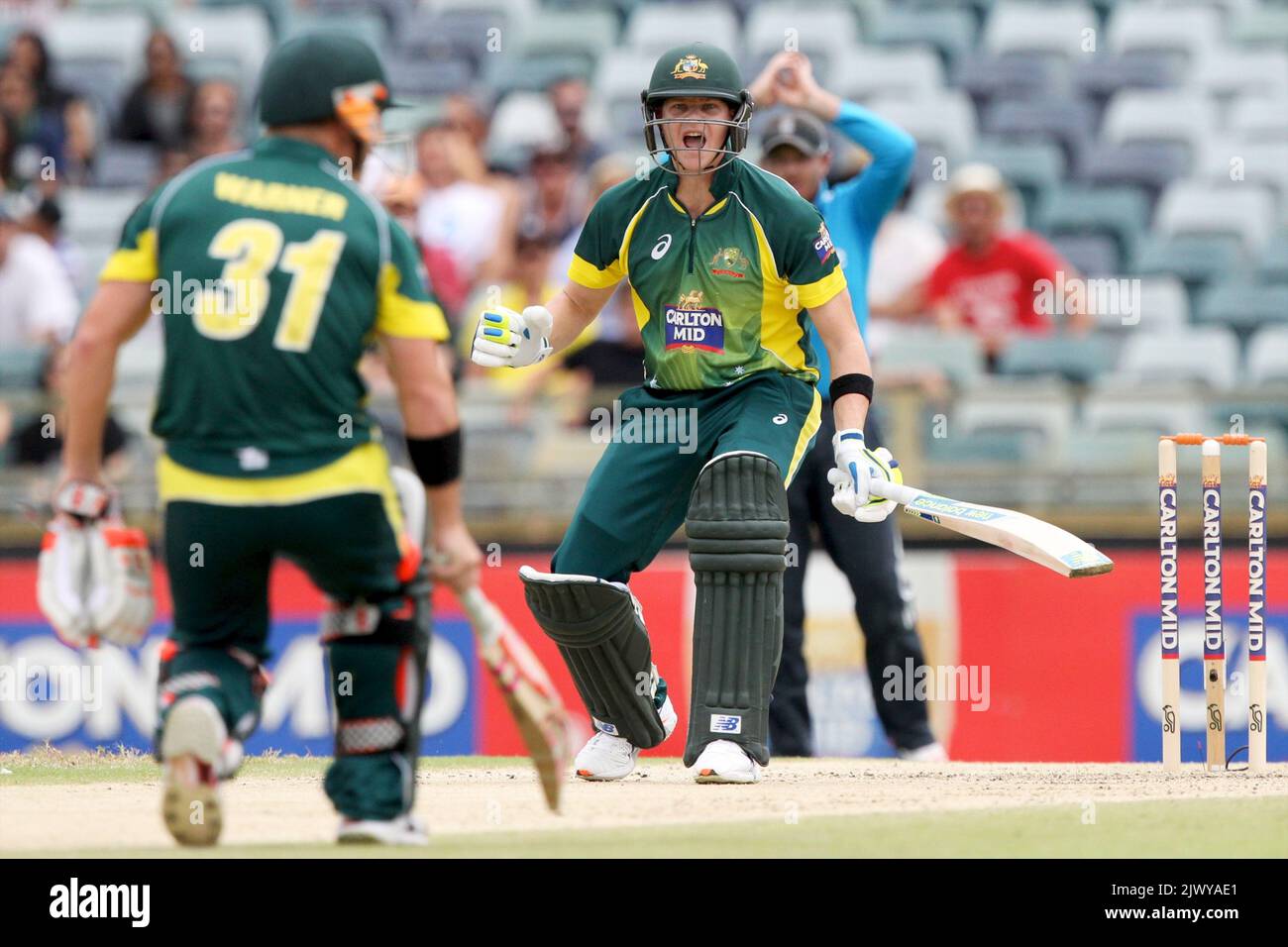 Steve Smith of Australia shouts to David Warner to stay during the ...