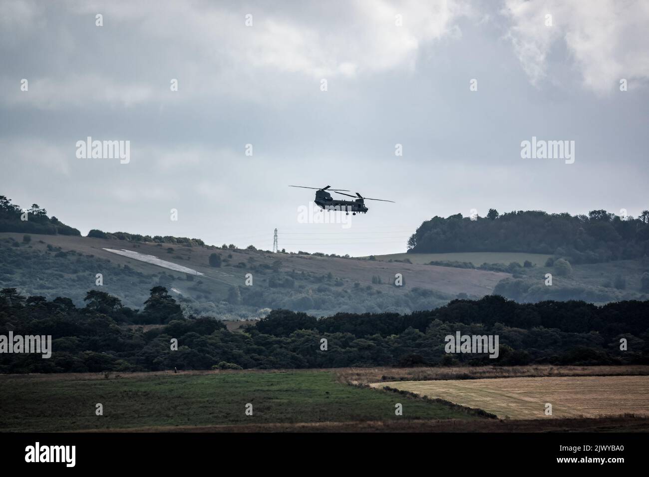 RAF Chinook tandem-rotor CH-47 helicopter flying fast and low in a ...