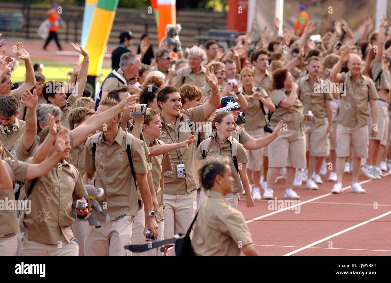 Members of the Australian Deaflympics team march out waving to the ...
