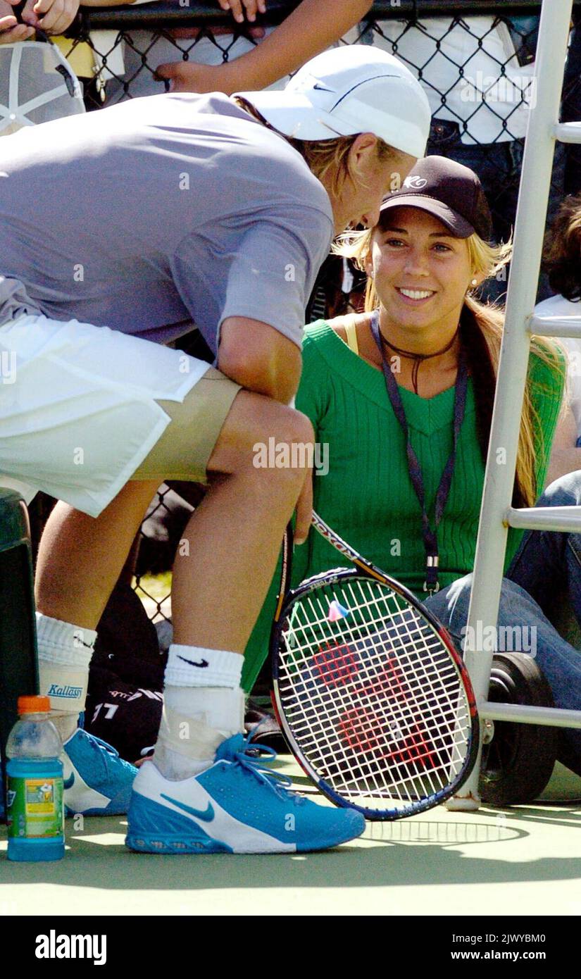 Australia's Leyton Hewitt sits with his new girlfriend Bec Cartwright ...
