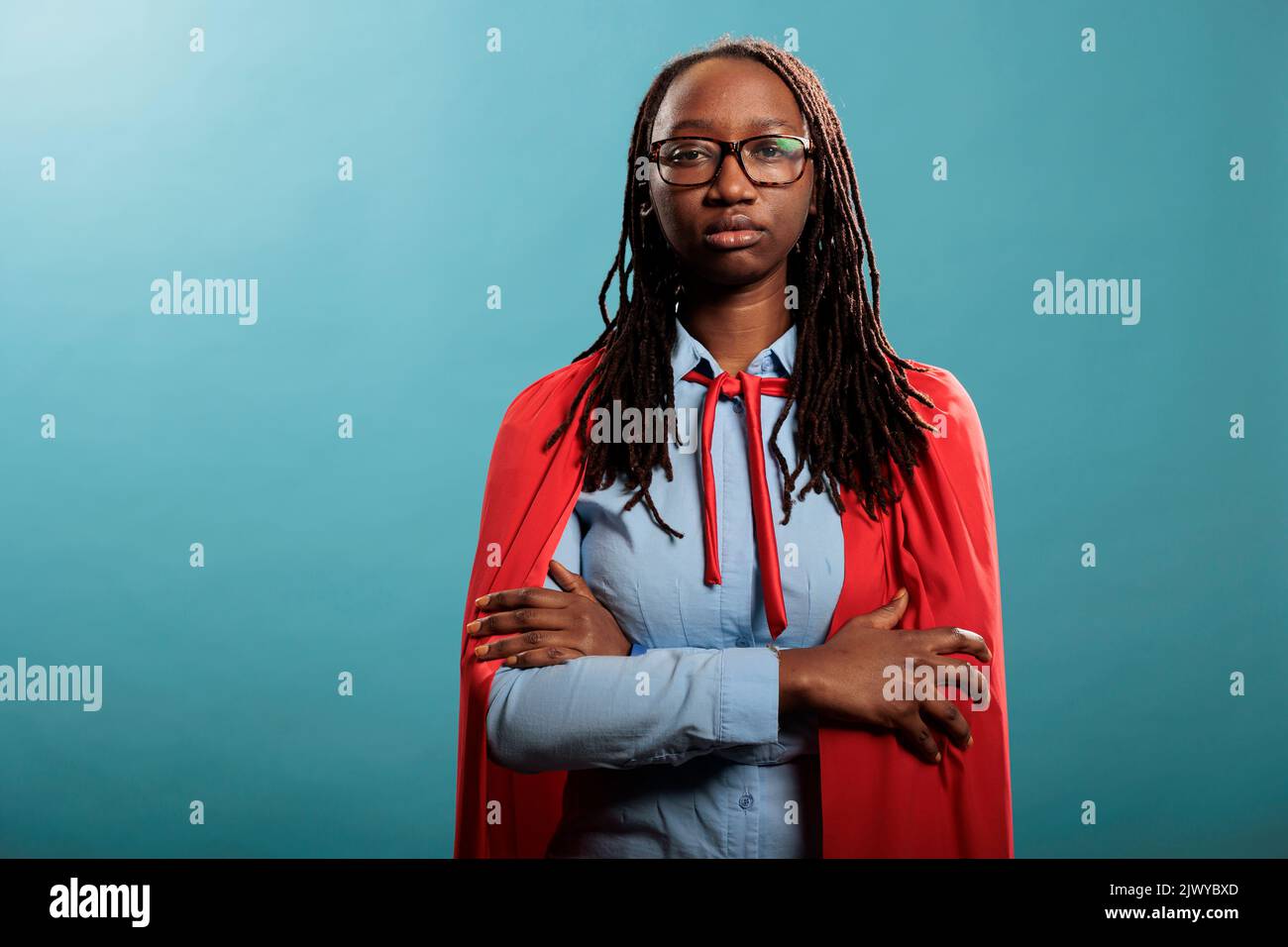 Brave and proud superhero woman wearing mighty hero cloak while ...