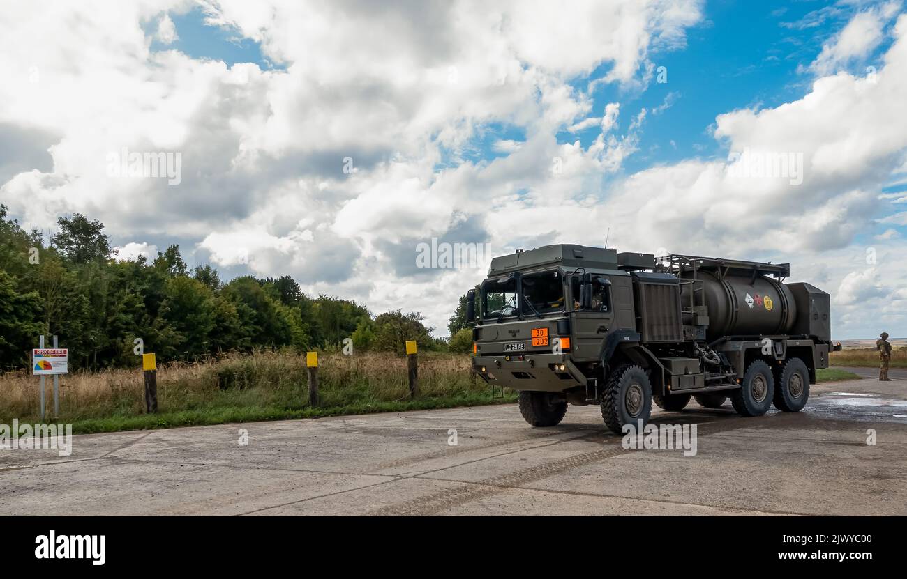 British army M.A.N. unit support tanker in action on a military ...