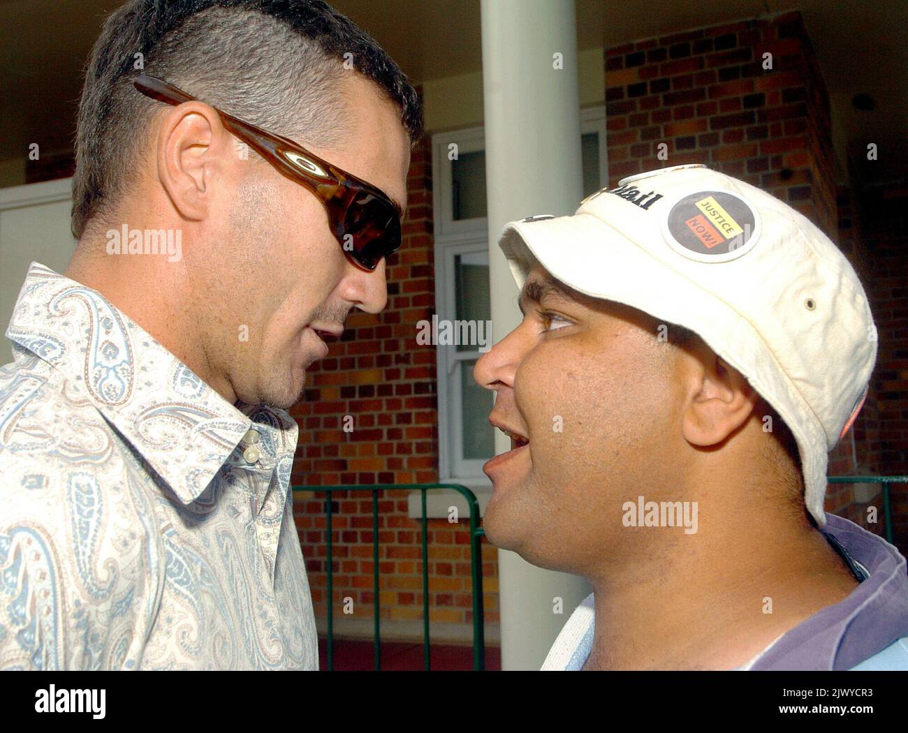 An Aboriginal protestor (r) argues with a man outside the Goondiwindi ...