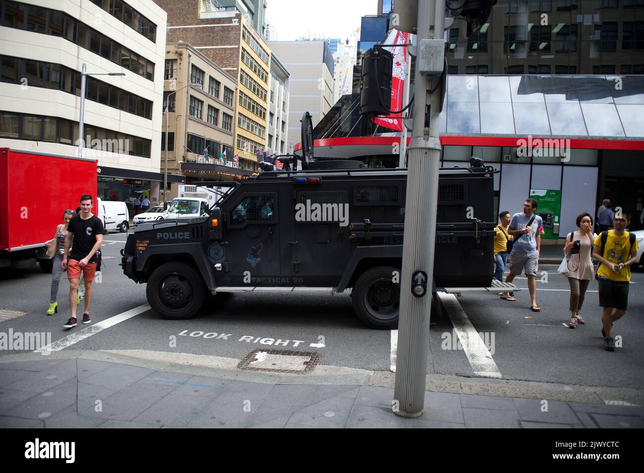 A NSW Police armed tactical response vehicle patrols the streets ...