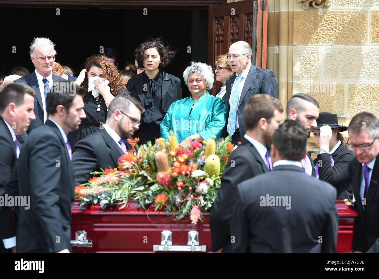 Daughter Lilon Bandler (in blue) watches as the casket of Faith Bandler ...