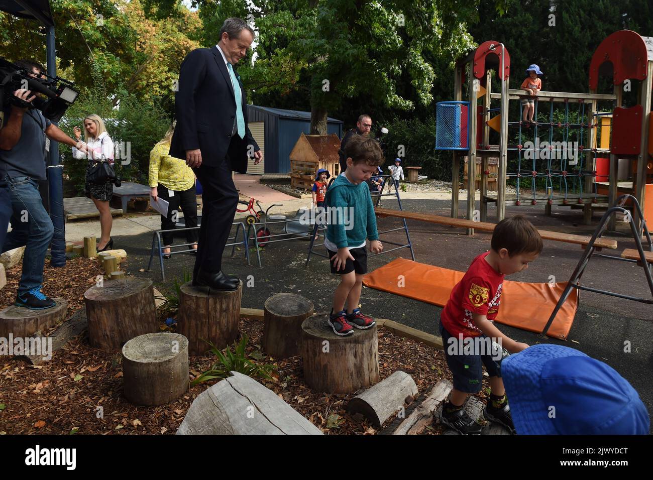 Opposition leader Bill Shorten watches as children play in a playground ...