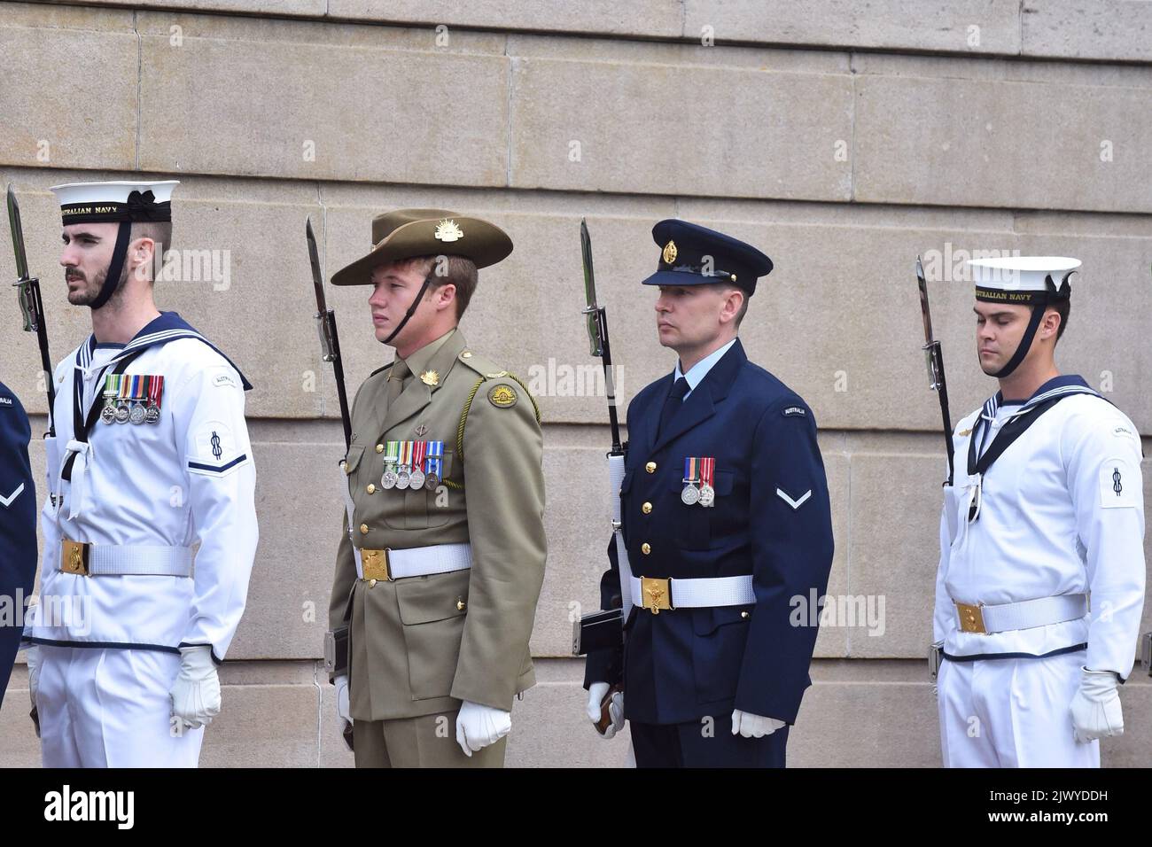 Members of Australia's defence forces form an honour guard at the ...