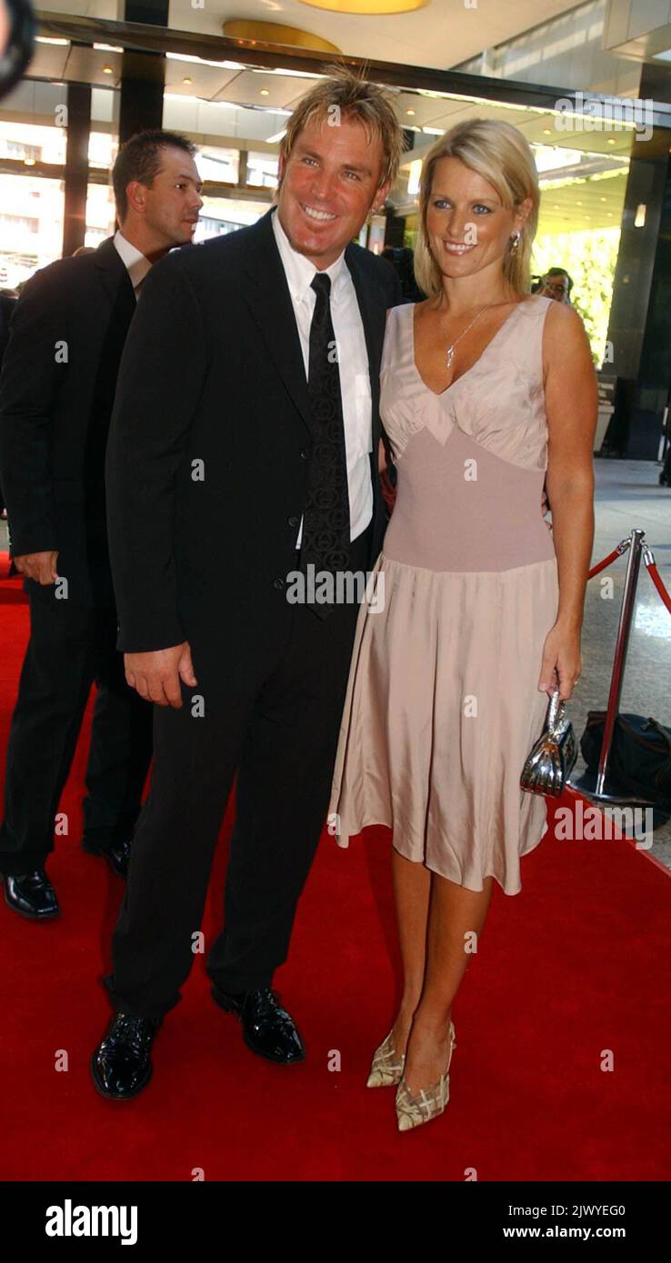 Australian cricketer Shane Warne arrives with his wife Simone Warne ...