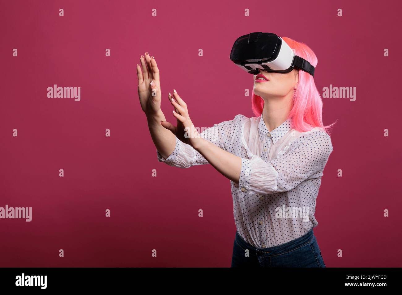 Cheerful woman using virtual reality glasses with 3d vision ...