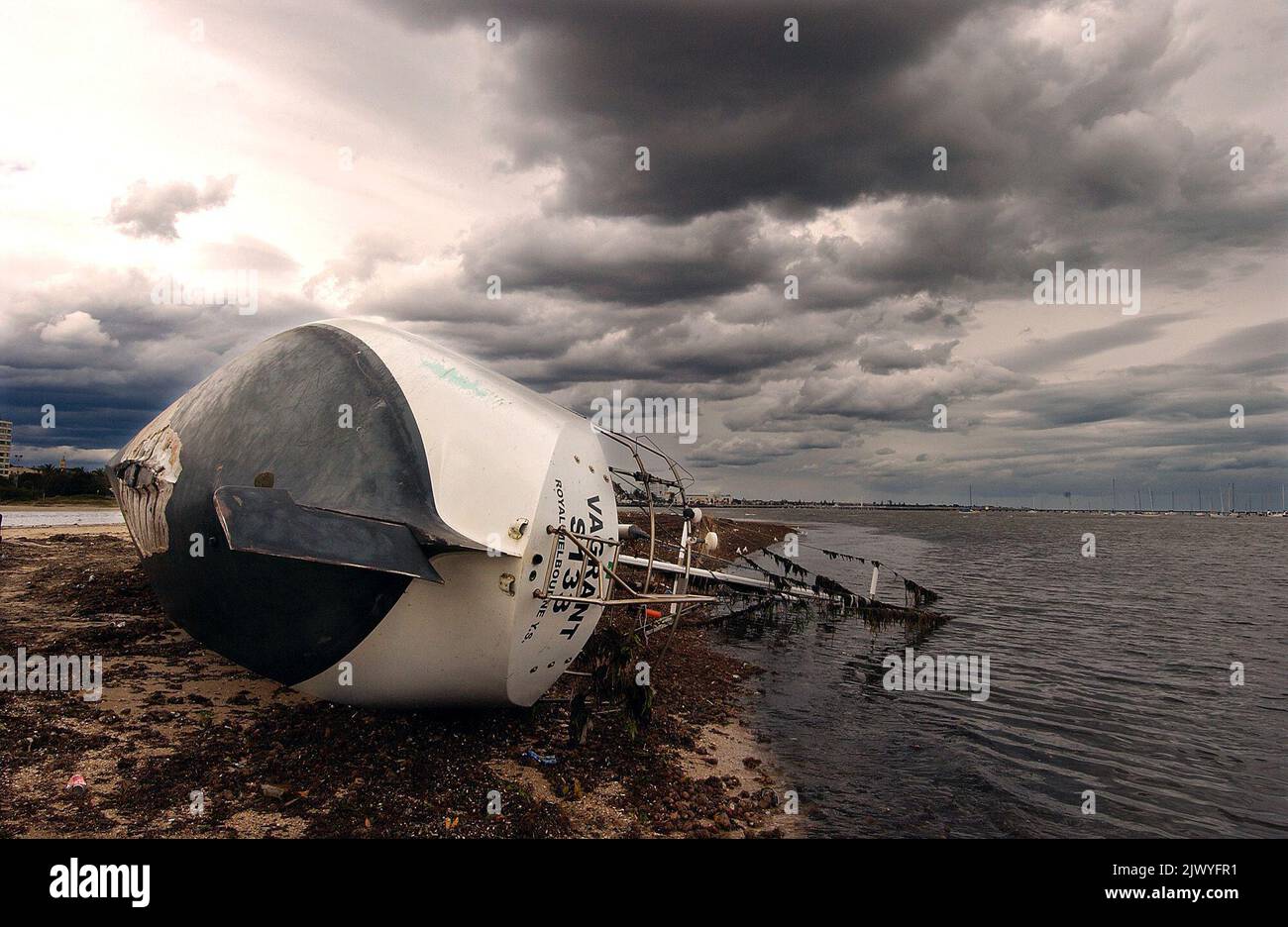 A boat lies washed ashore on St Kilda beach after Melbourne was lashed ...