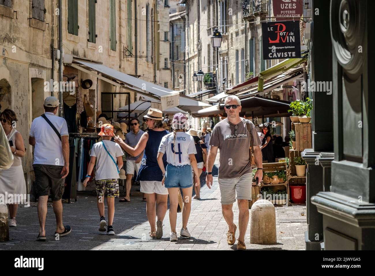 People walking through streets in the center of Uzes, France Stock ...