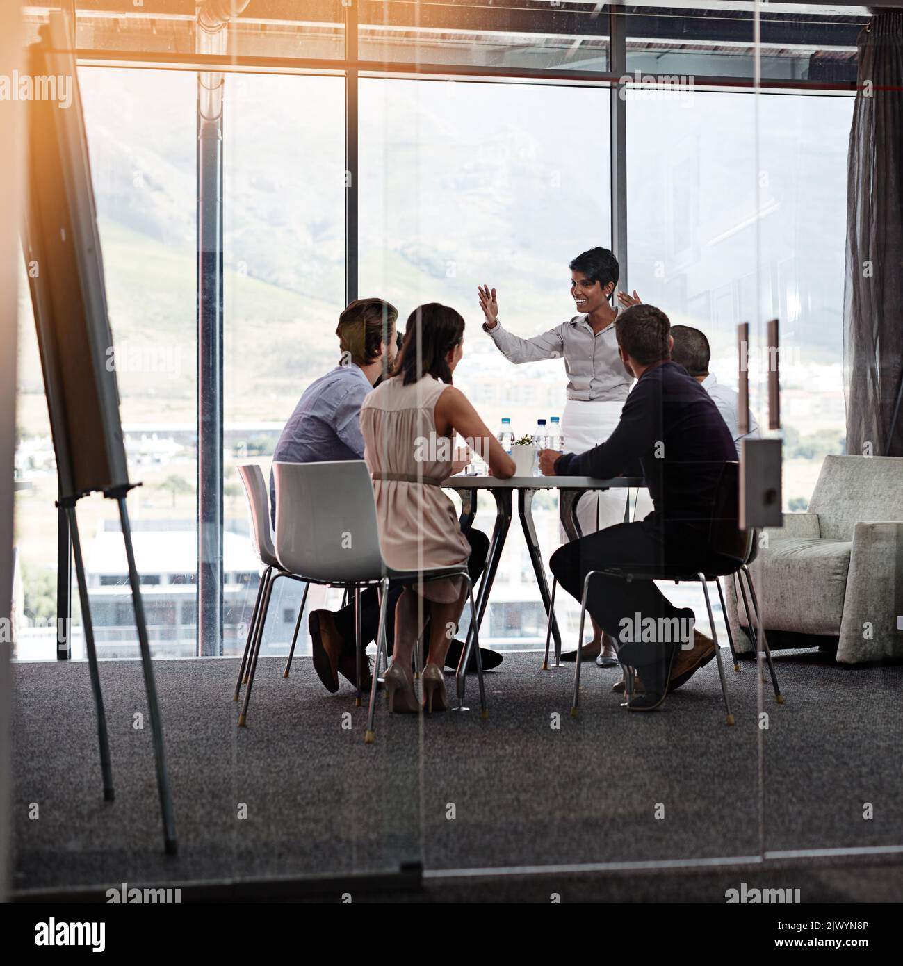 Passing on her experience in business. a businesswoman giving a ...