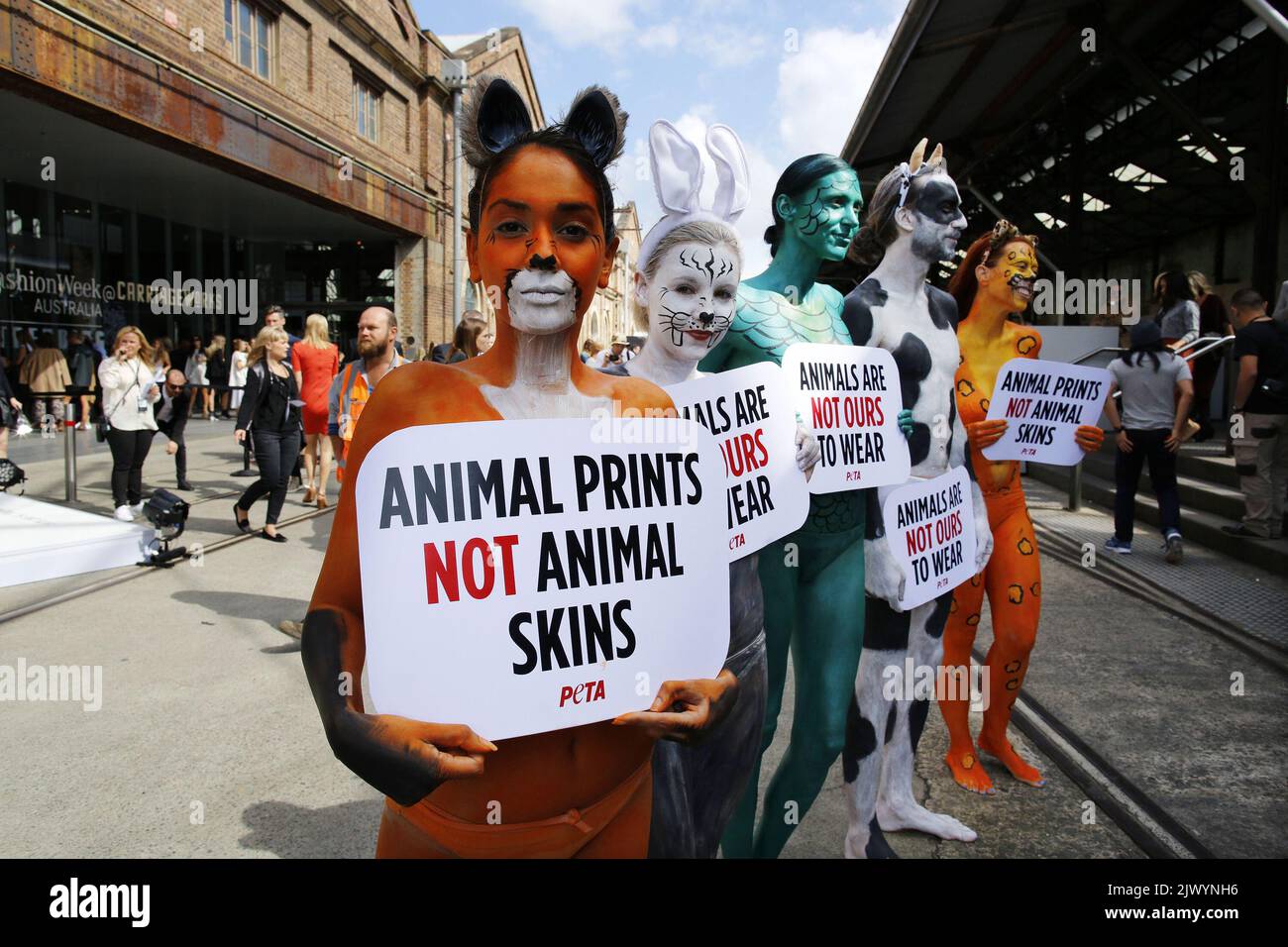 Members of PETA with their bodies painted like animals, protest outside ...