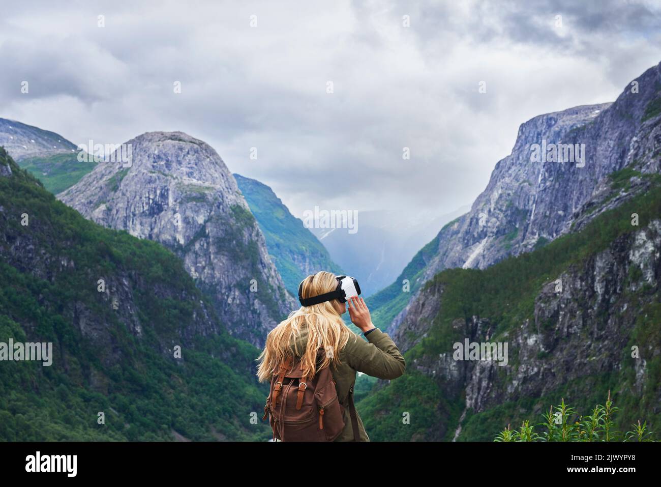 Adventure woman wearing vr headset augmented virtual reality in ...