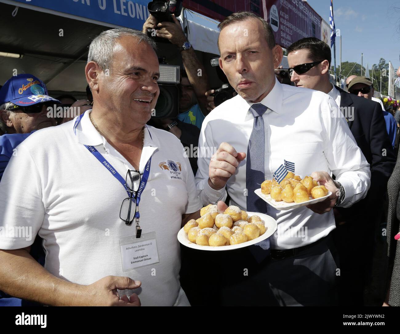 Australian Prime Minister Tony Abbott with stall owner Emannuel Drivas ...