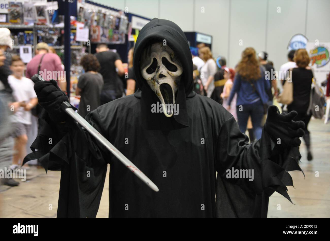 A cosplayer dressed as Ghostface from the horror film franchise Scream ...