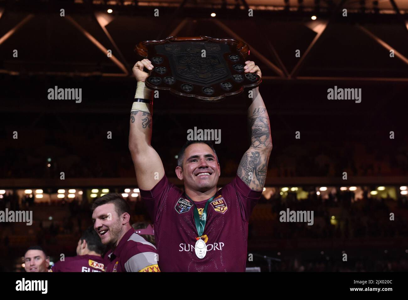 Corey Parker of the Maroons celebrates with the winners shield and ...