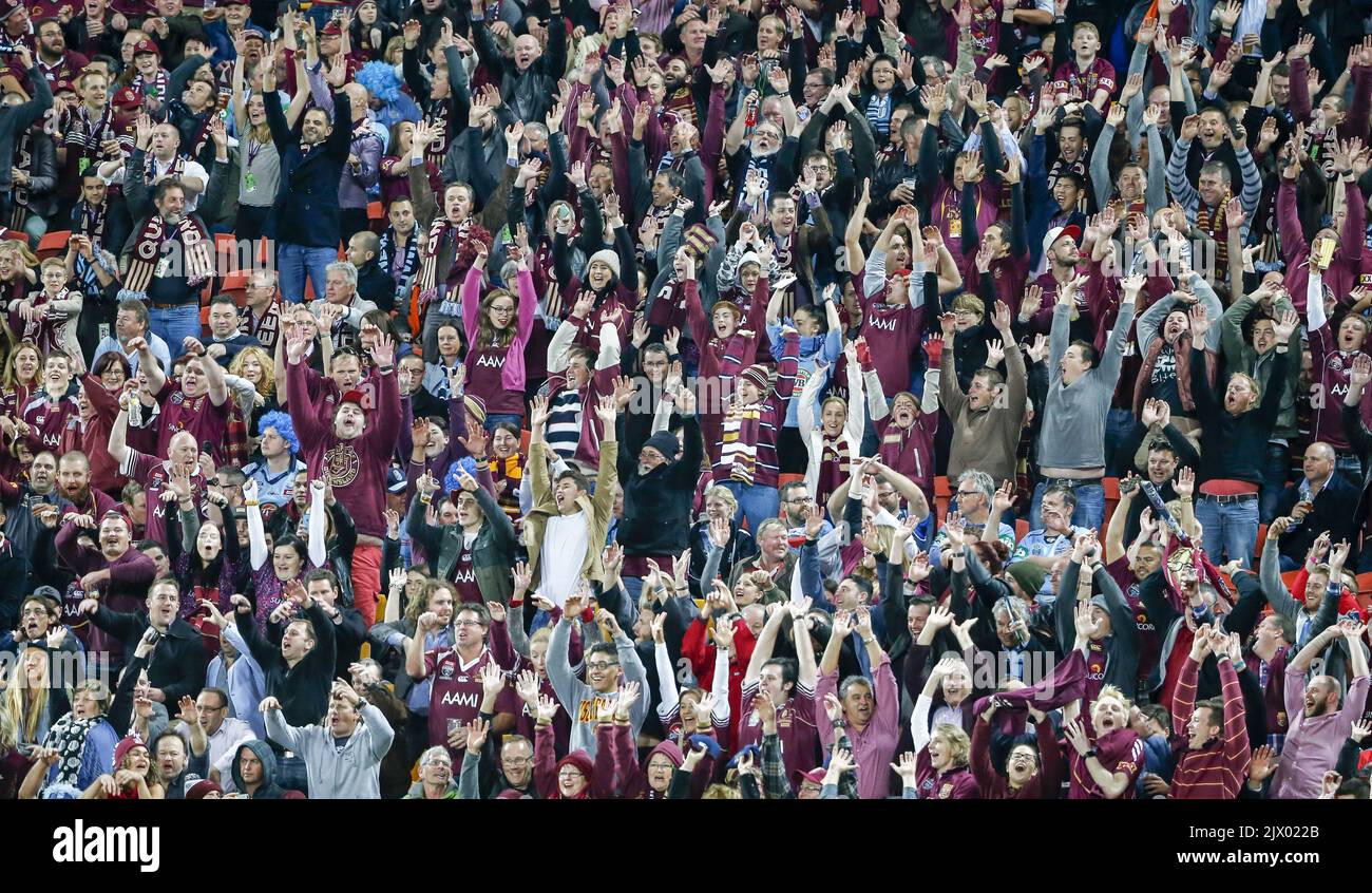 Queensland Maroons fans celebrate during State of Origin Game III ...