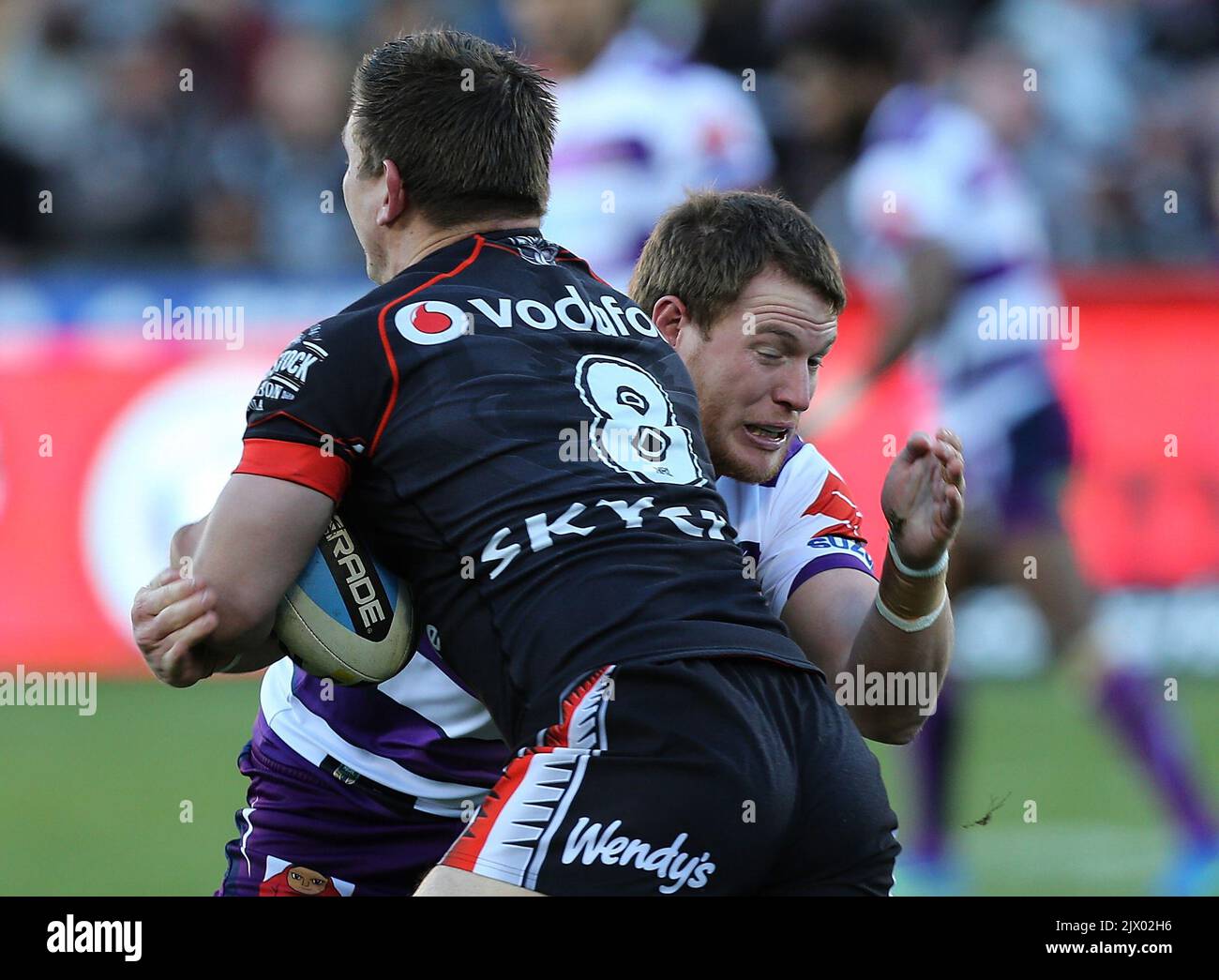 Tim Glasby of the Melbourne Storm tackles Jacob Lillyman of the New ...