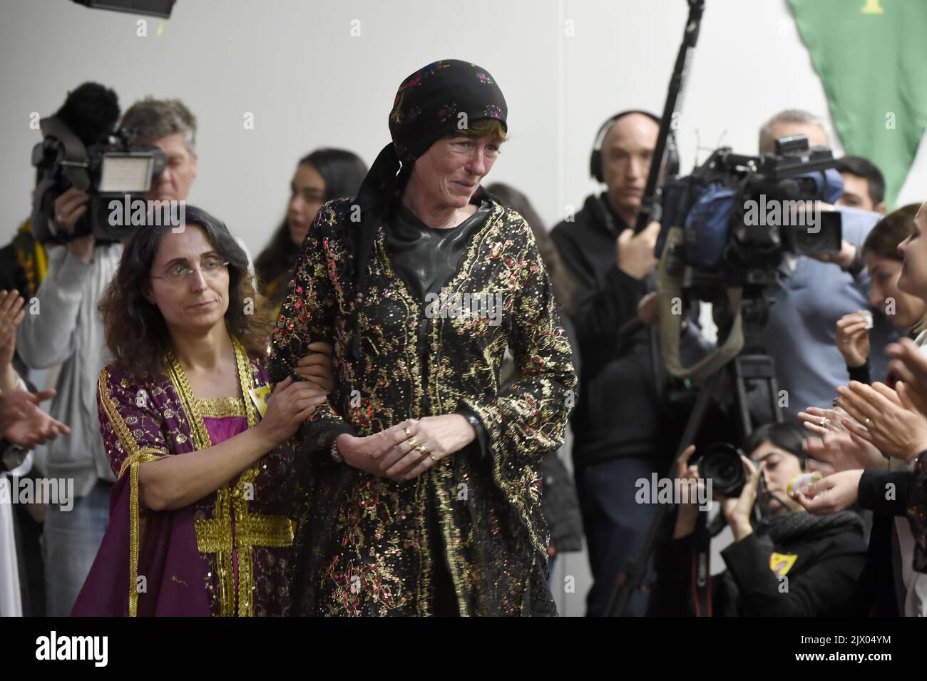 Michele Harding (C) is seen at the Kurdish funeral service held for her ...
