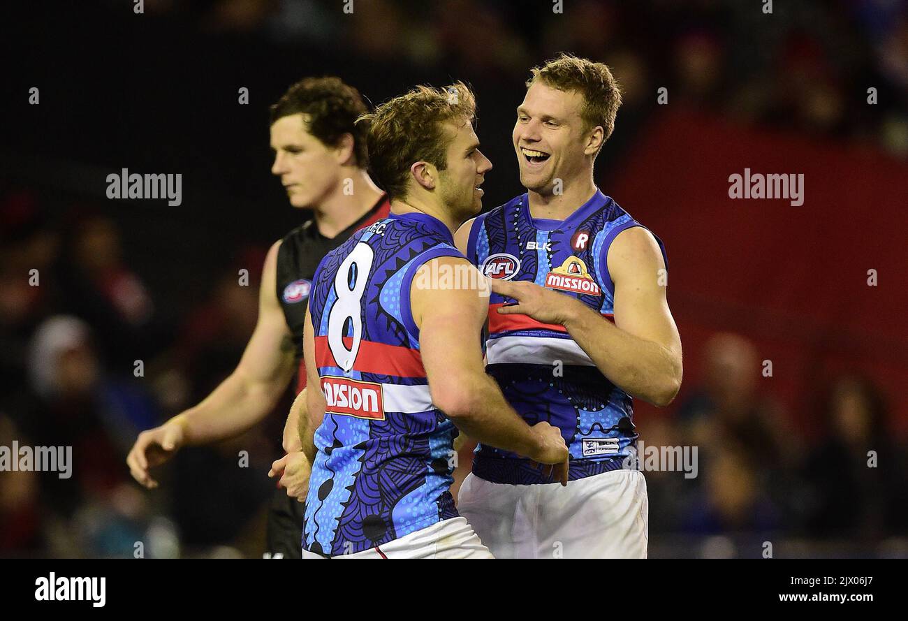 Western Bulldogs players Stewart Crameri (centre) and Jake Stringer ...