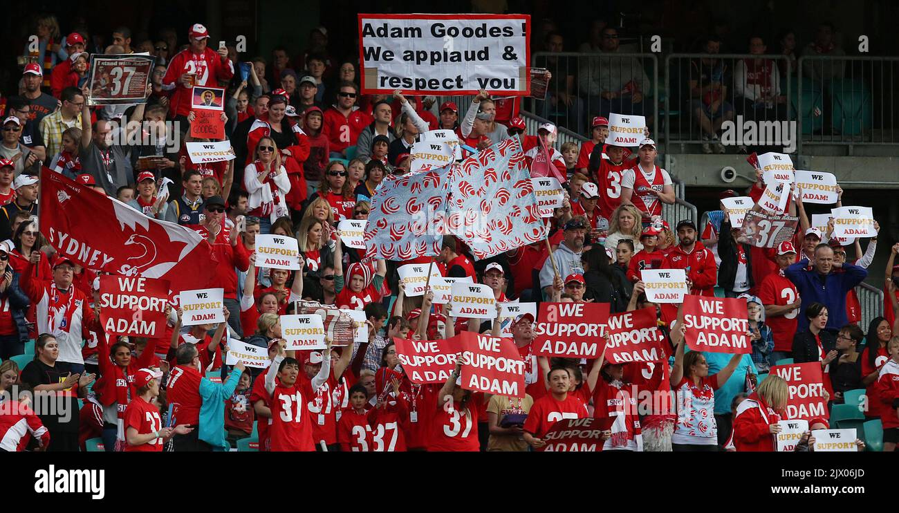 Sydney Swans fans holds banners in support of player Adam Goodes during ...