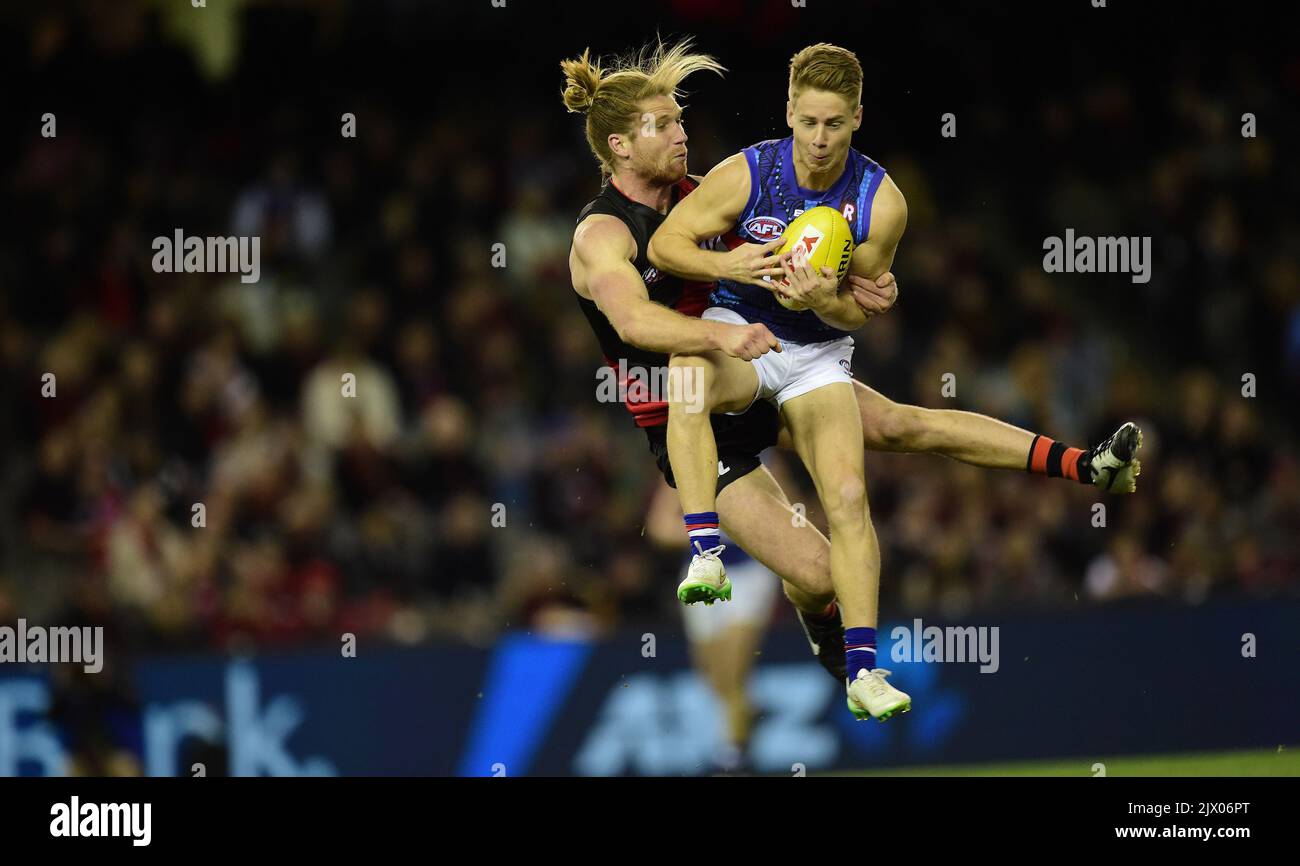 Western Bulldogs player Lachie Hunter (right) and Essendon Bombers ...