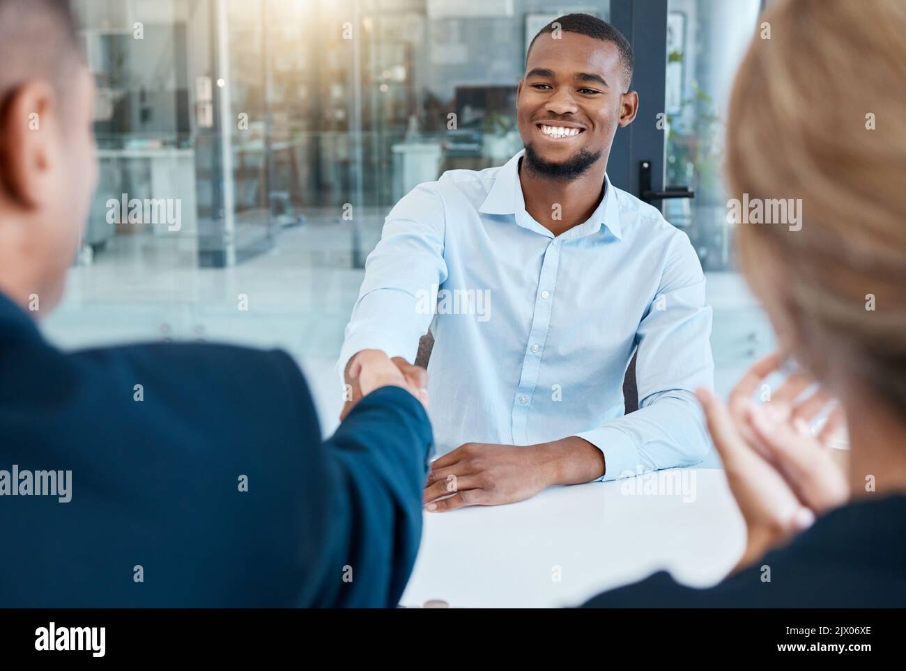 Shaking hands, interview and business people give a handshake after ...